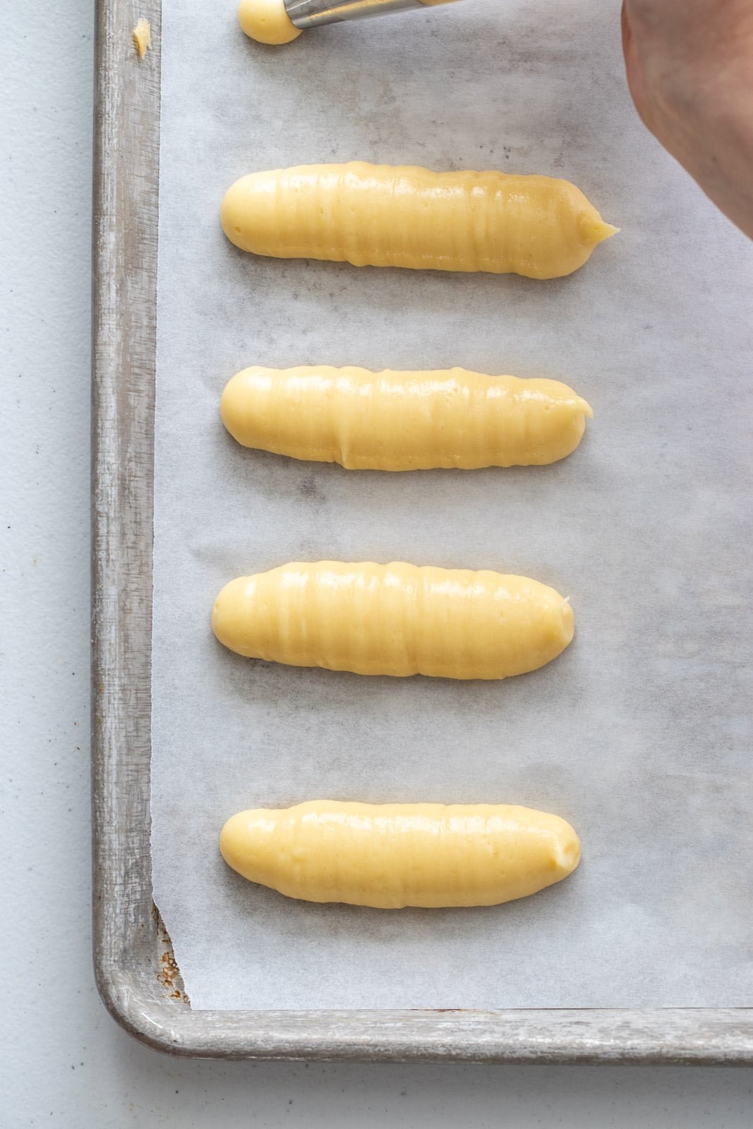 Delicious Lemon Meringue Eclairs - A Red Spatula